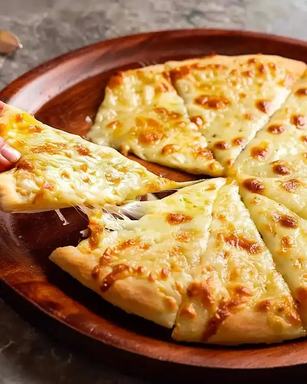 Cheesy Garlic Pizza Bread: Ready In Just 8 Minutes - Eden Plate